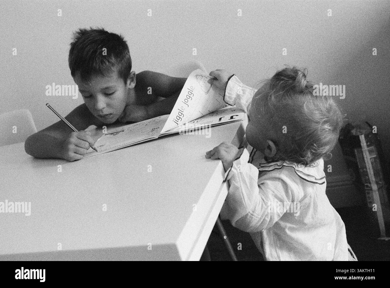 Boy table homework Black and White Stock Photos & Images - Alamy