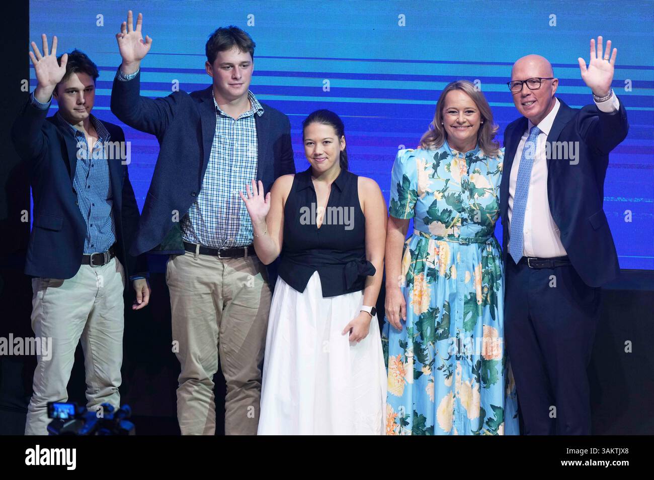 Australian Liberal Party leader Peter Dutton, right, stands with his ...