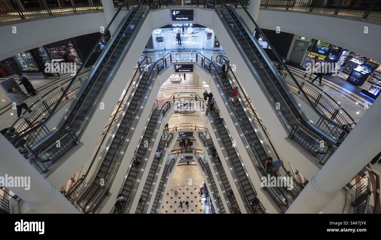 High angle shot of modern multistorey shopping mall. People traffic on ...