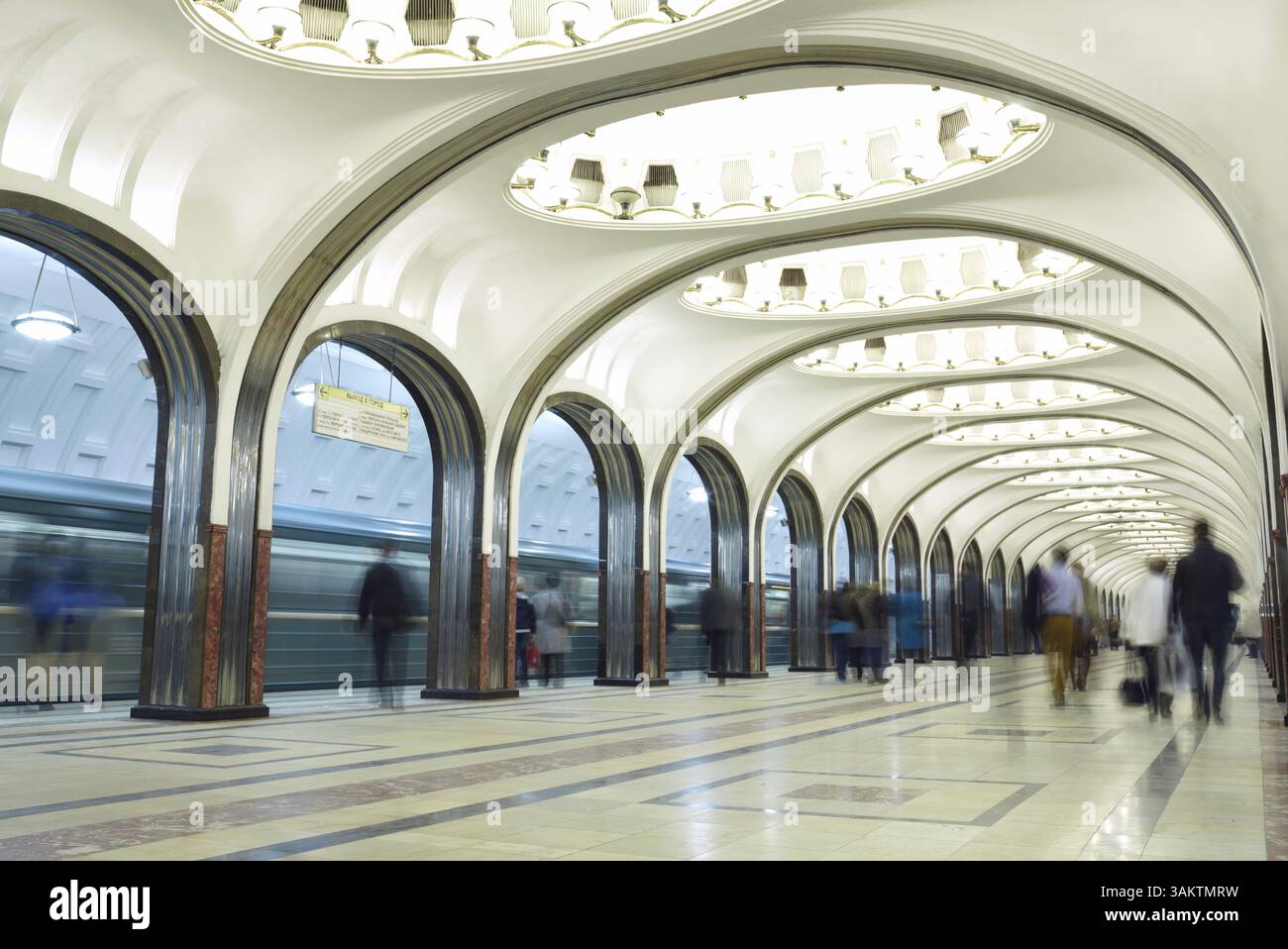 Motion blurred commuters at the metro station. Mayakovskaya station in ...