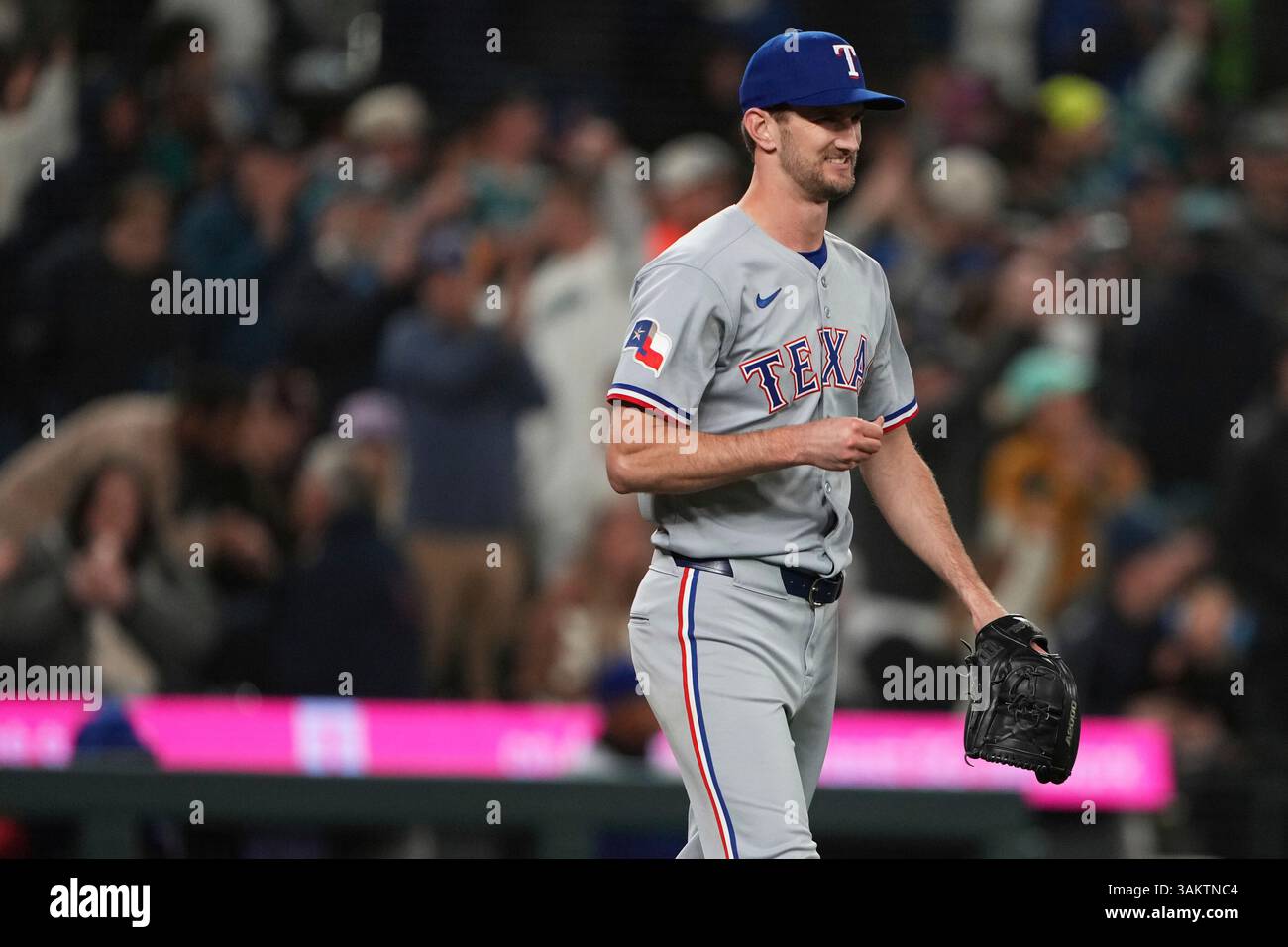 Texas Rangers relief pitcher Caleb Boushley reacts to giving up a two ...