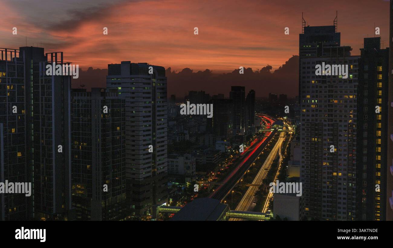 Bangkok city view at sunset. High-rise buildings, traffic trails on the ...