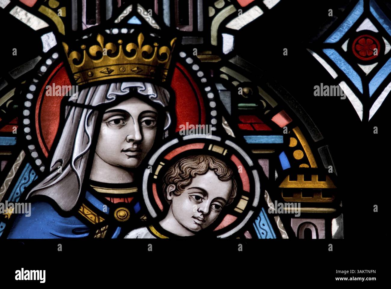 Stained glass maria with jesus Stock Photo - Alamy