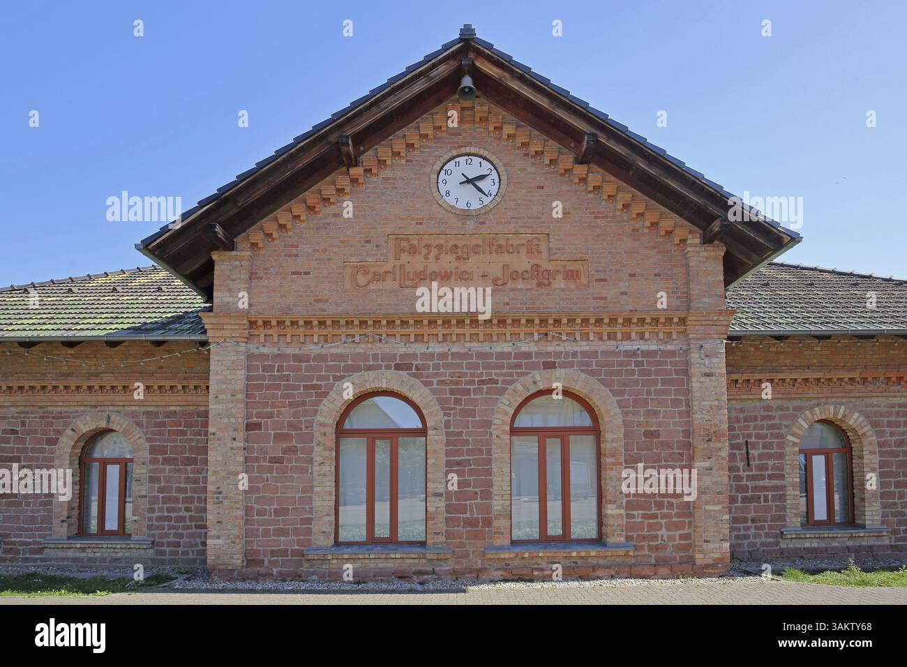 Historic Brickworks Museum built in 1887 with inscription and clock ...