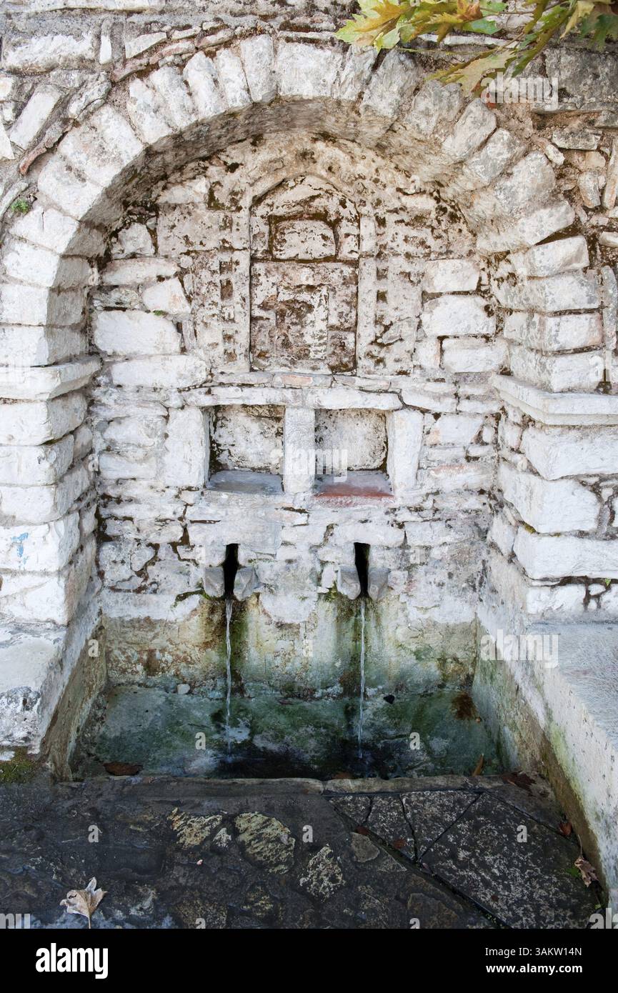 Greek water fountain with bright drinking water Stock Photo - Alamy