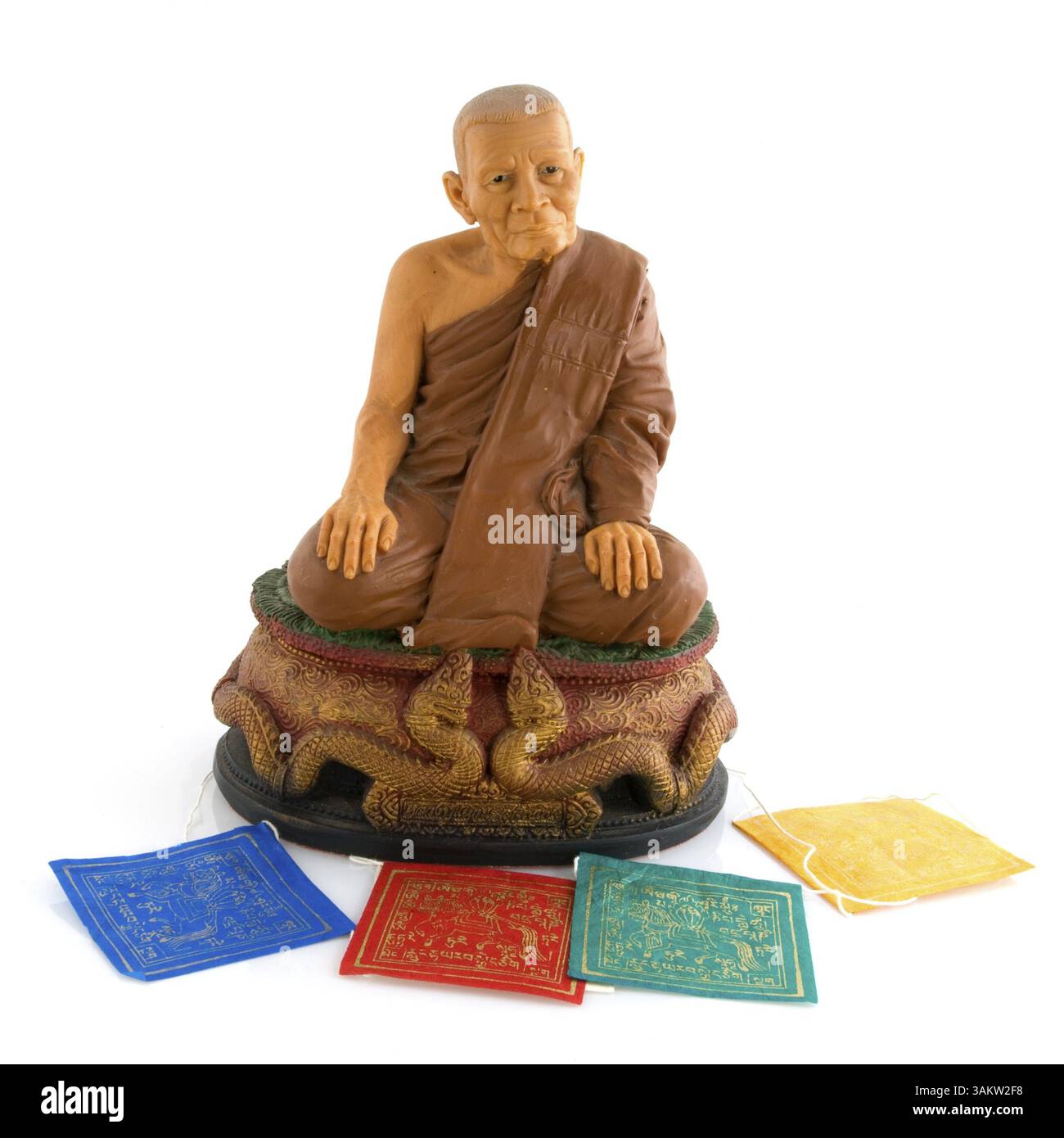 Buddhism monk with colored religious flags Stock Photo - Alamy