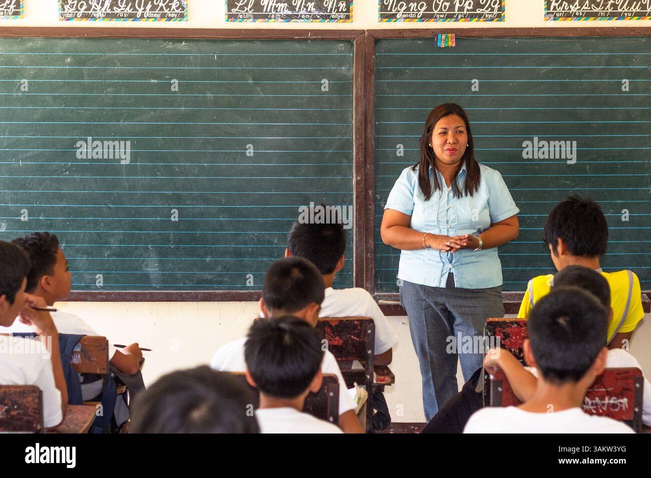 A public elementary school teacher in Batangas, Philippines teaches her ...