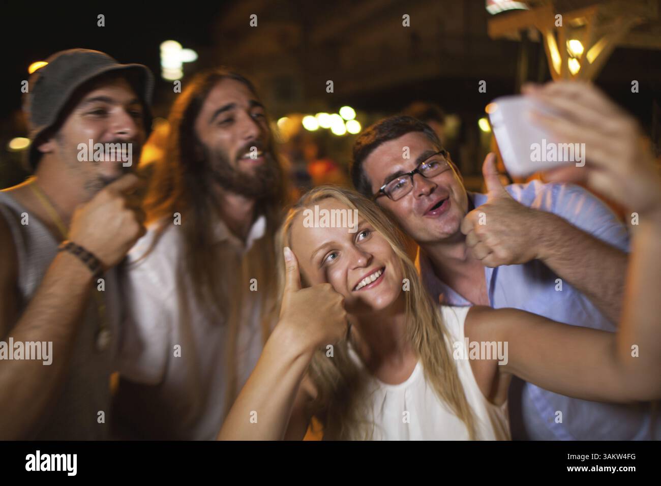 Group of happy and excited young people having good time outdoor at ...