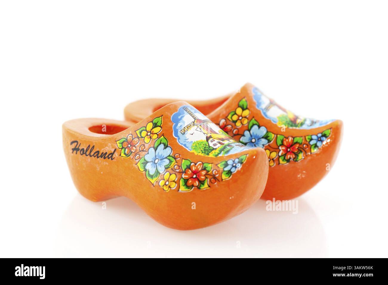 Orange Dutch clogs with Holland isolated over white Stock Photo - Alamy