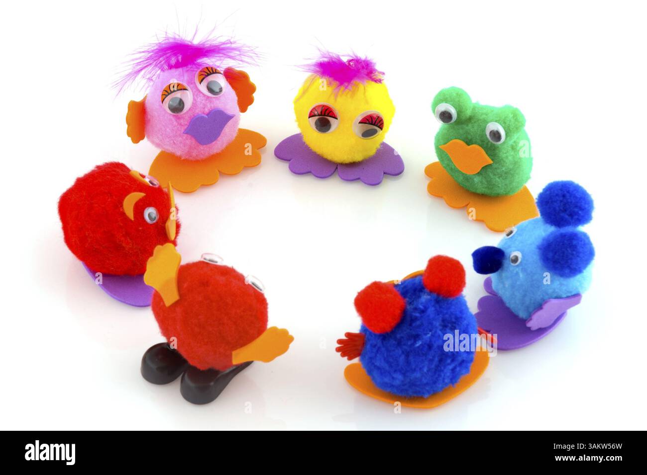 Funny little dolls are playing in a circle Stock Photo - Alamy