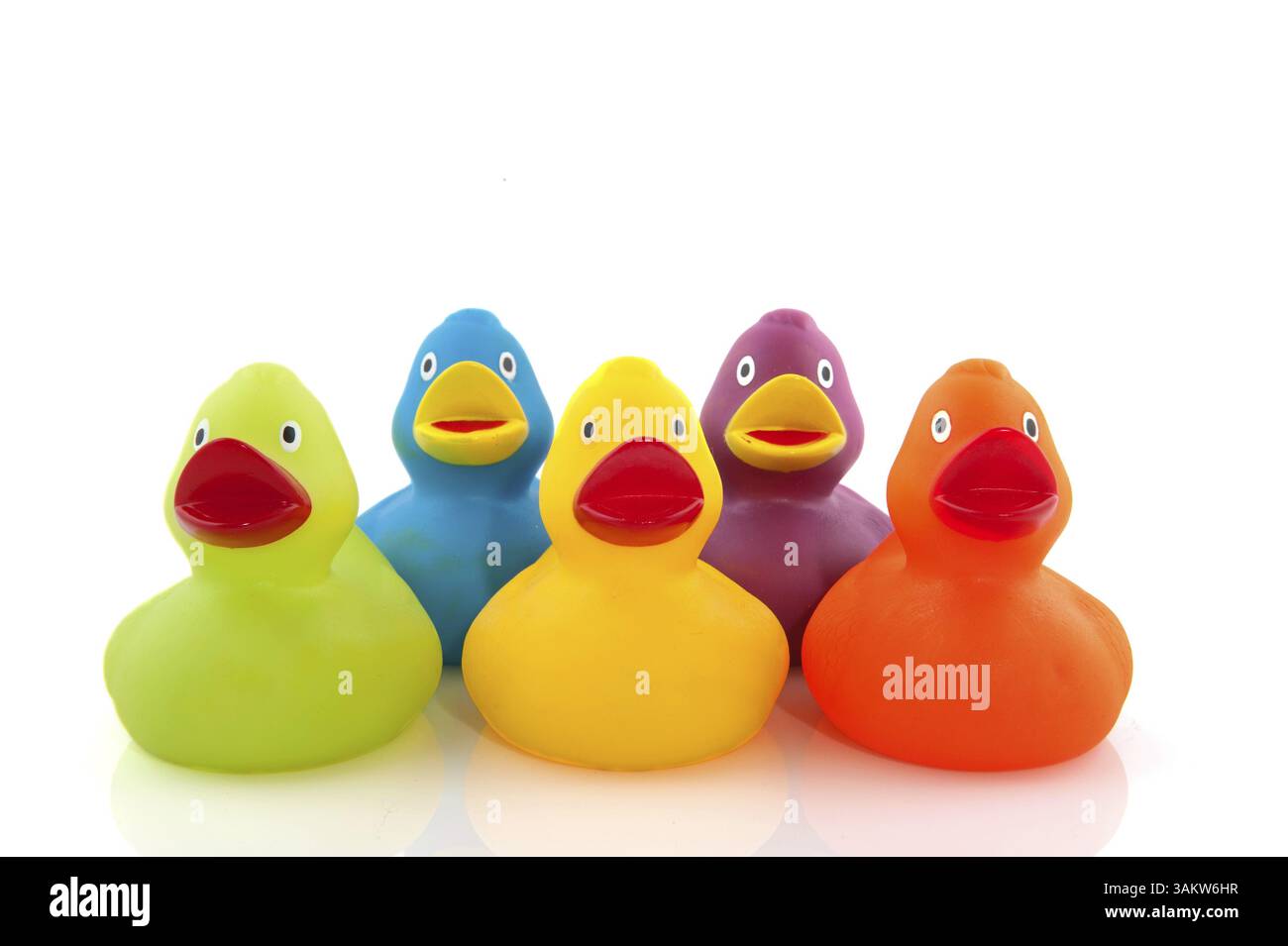 Colorful ducks in a row Stock Photo - Alamy