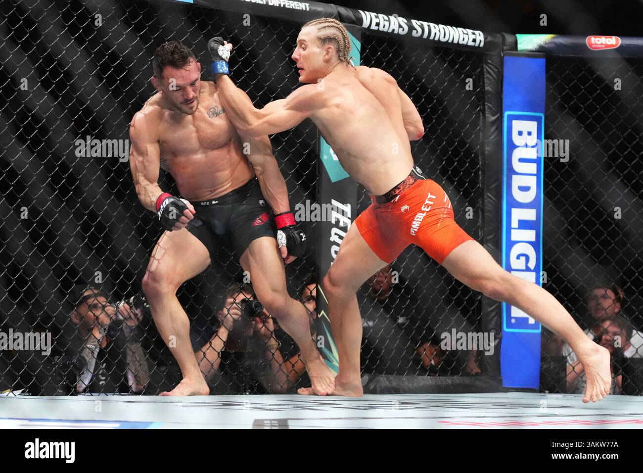 Michael Chandler, left, and Paddy Pimblett battle during a mixed ...