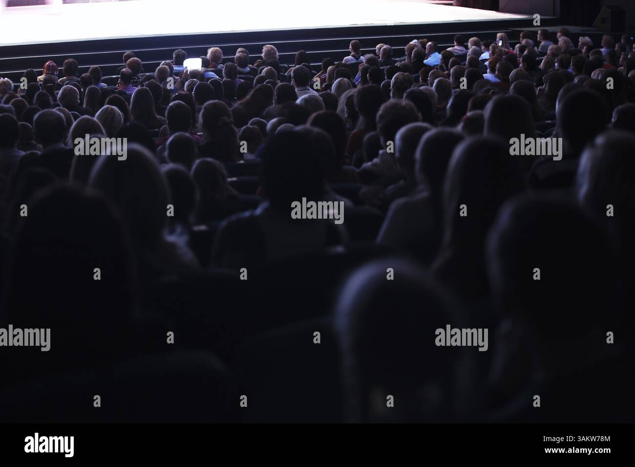 Crowd in auditorium facing hi-res stock photography and images - Alamy