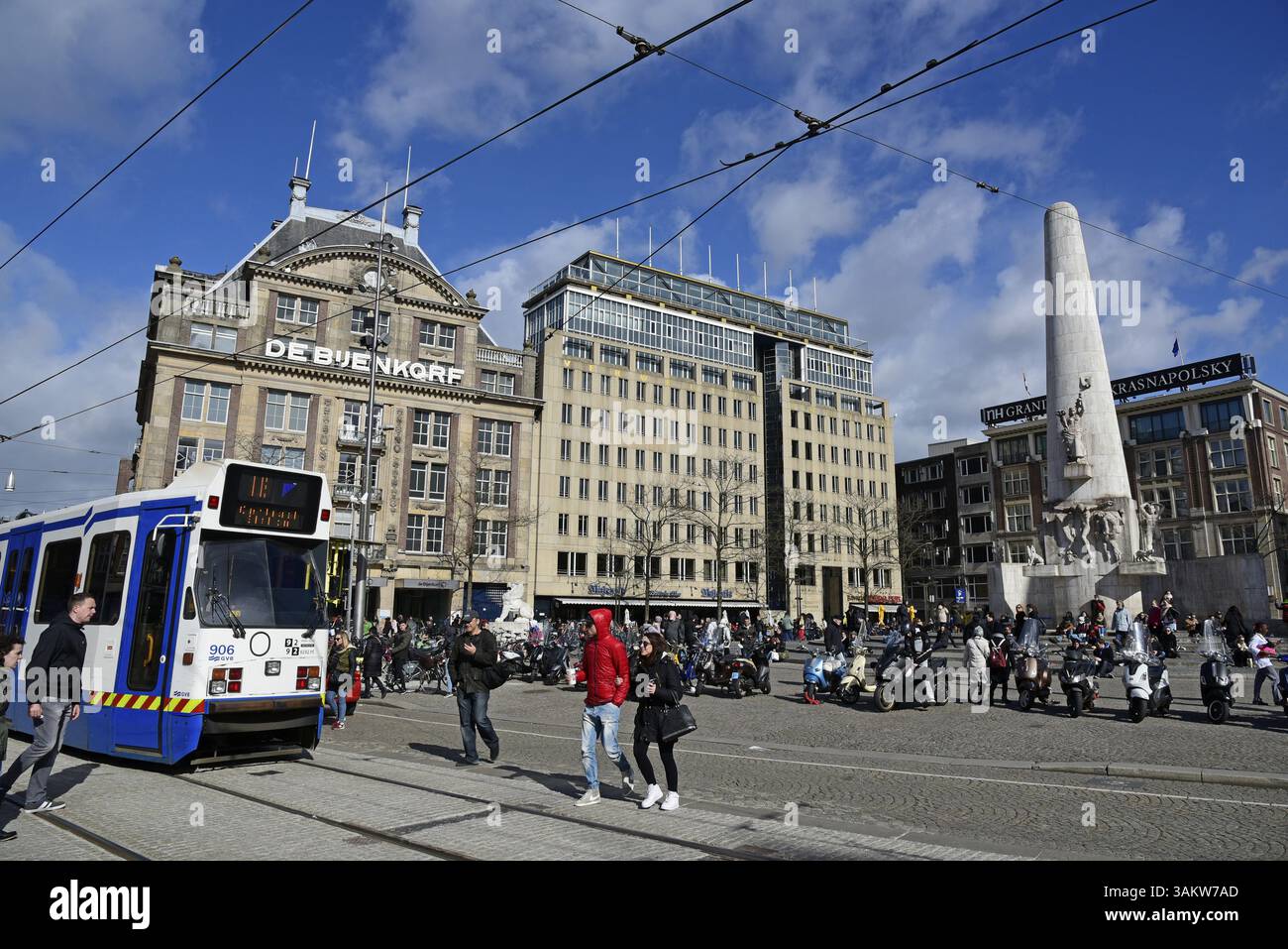 Tram, National Monument and De Bijenkorf shopping centre on Dam Square ...