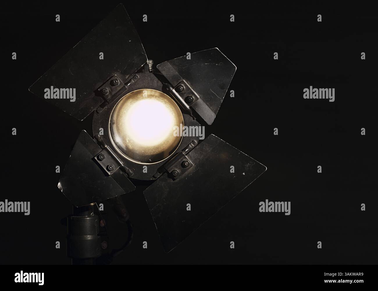 Studio floodlight on black background with warm tungsten light Stock ...
