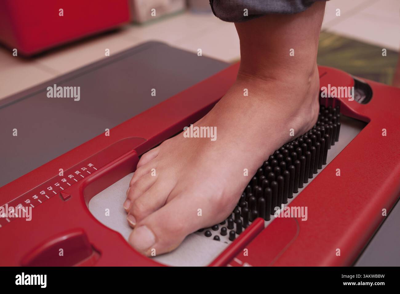 Close-up shot of foot being scanned on orthopedic device which creating ...