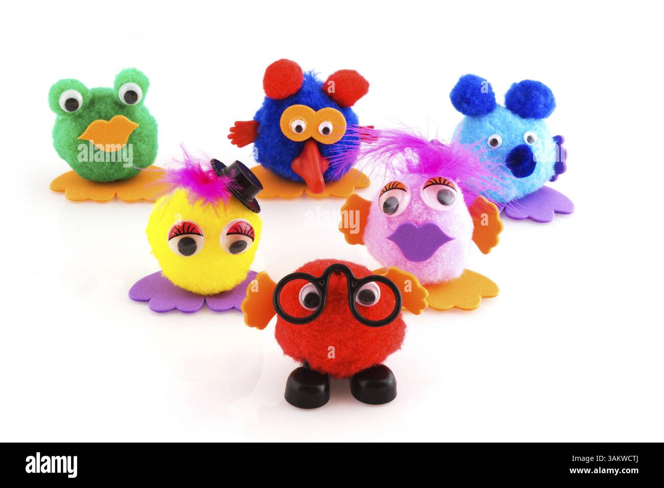 Cute handmade little colorful puppets Stock Photo - Alamy
