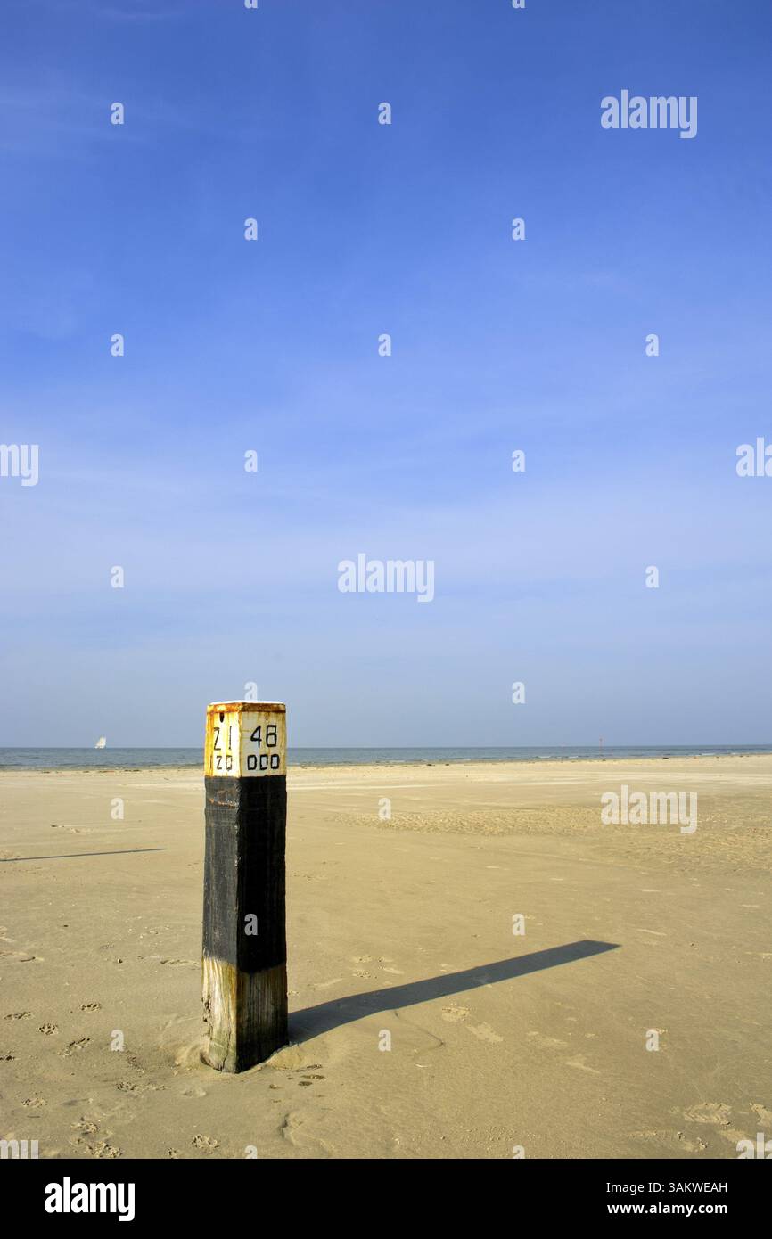 Pole with numbers at the empty beach Stock Photo - Alamy