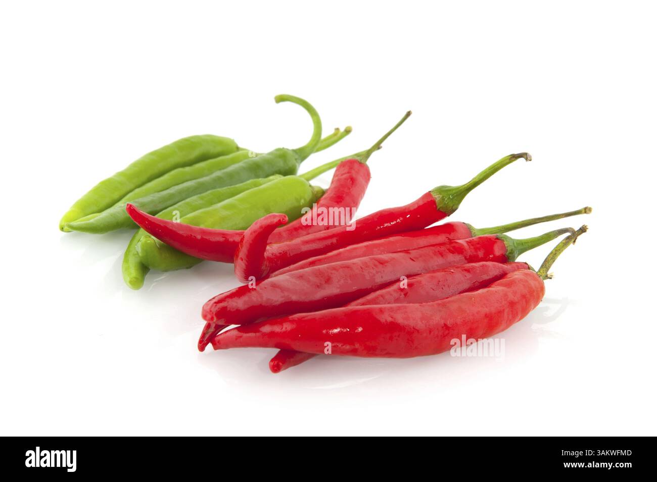 Red and green hot chilli peppers isolated over white Stock Photo - Alamy