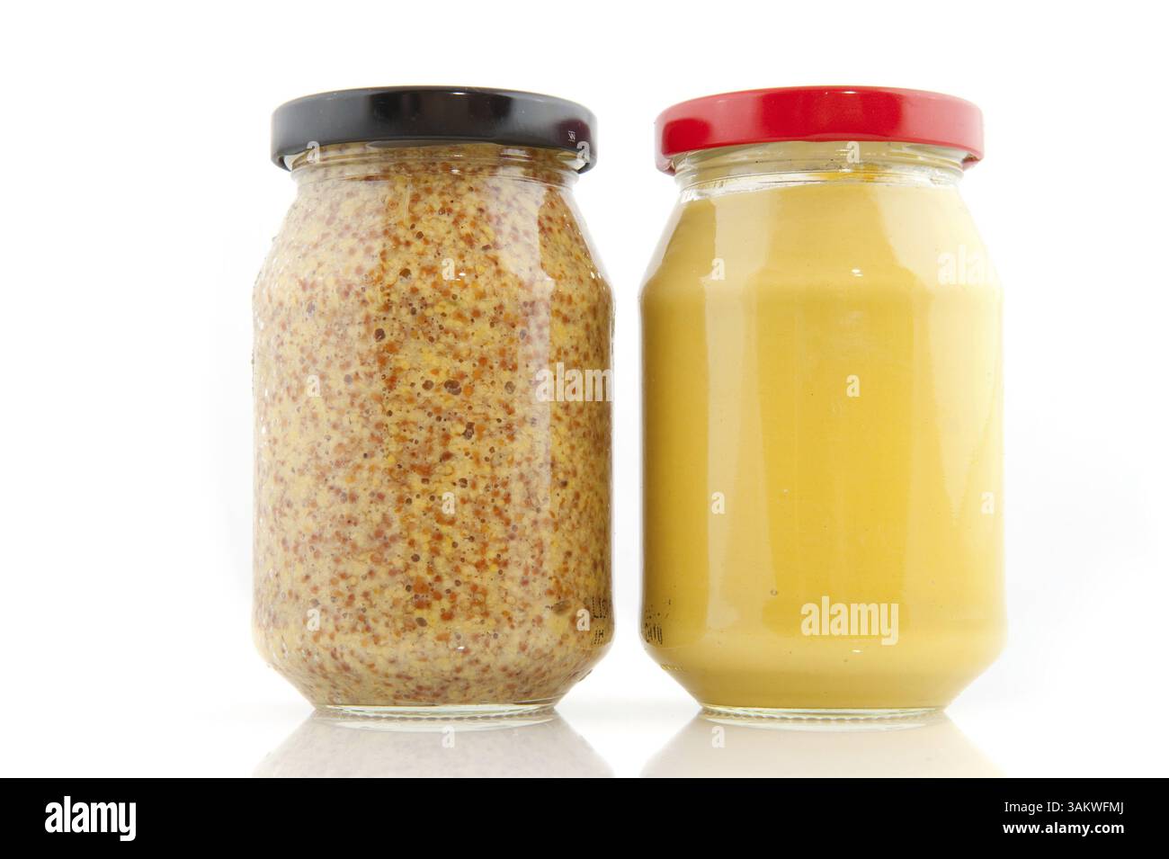 Two different kind of mustards isolated over white Stock Photo - Alamy