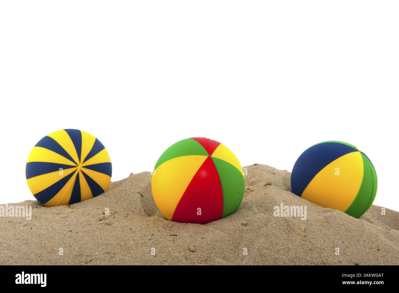 colorful toy balls in the sand from beach Stock Photo - Alamy
