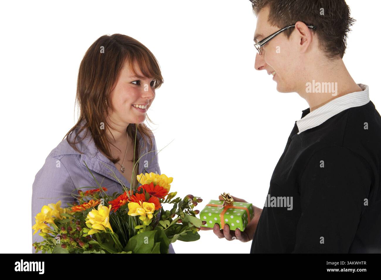 Girl is getting present and flowers from her boyfriend Stock Photo - Alamy