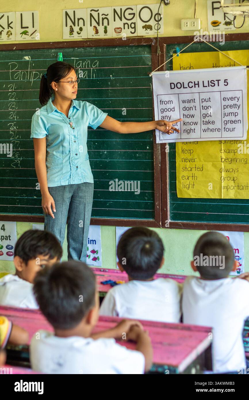 A public elementary school teacher in Batangas, Philippines teaches her ...