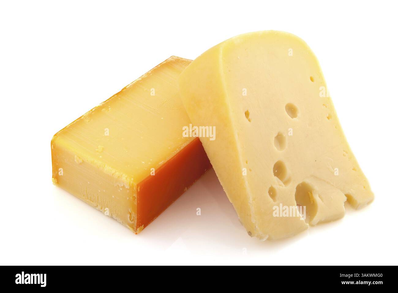 Pieces of old and young cheese in cube shape Stock Photo - Alamy