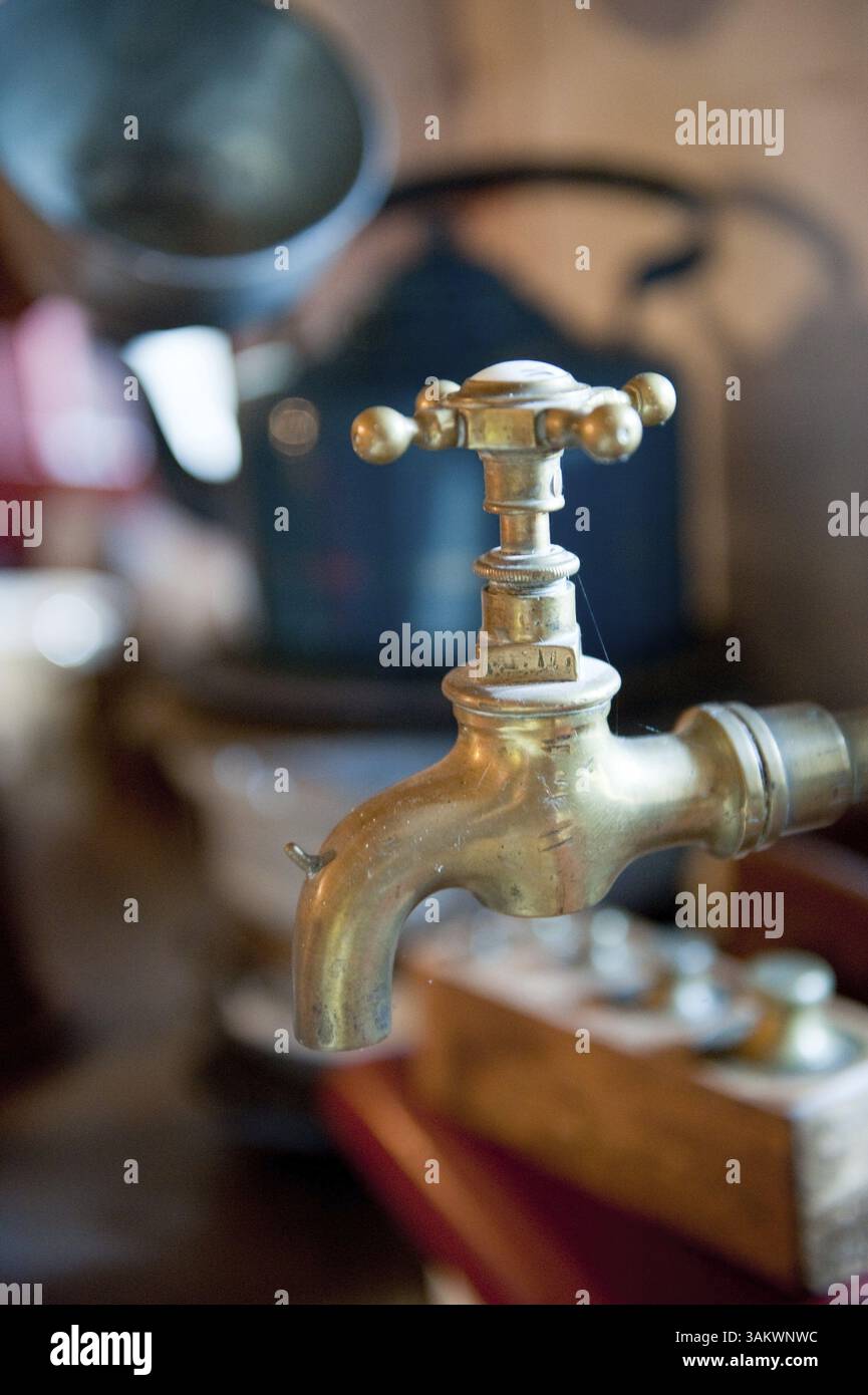 Old antique copper tap for water in the kitchen Stock Photo - Alamy