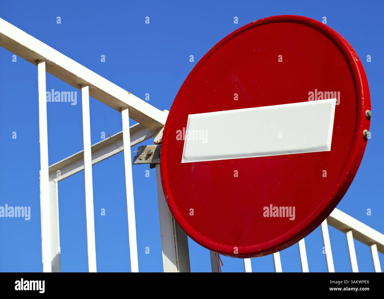 Round sign No Entry on blue sky background Stock Photo - Alamy