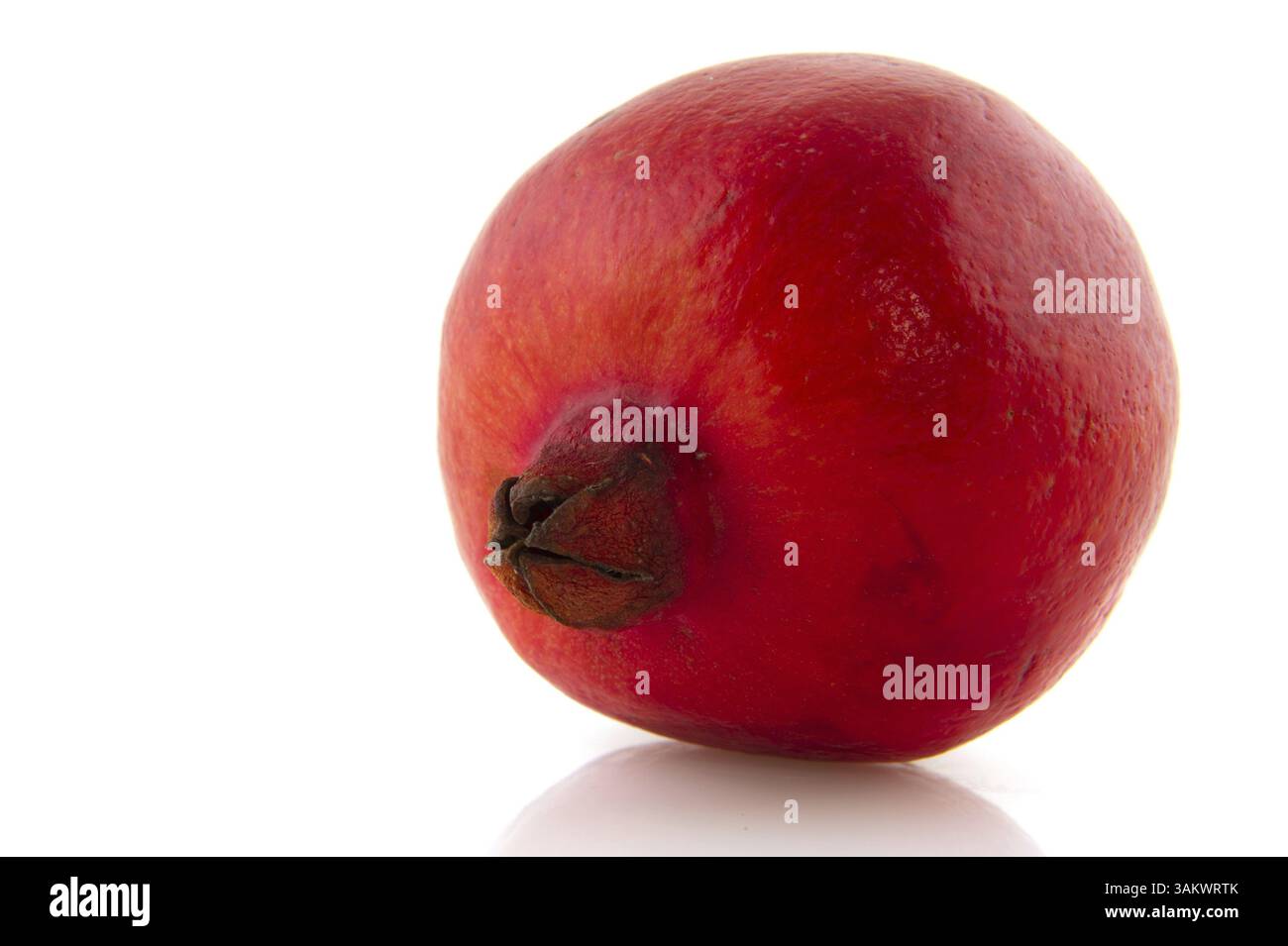 Fresh whole pomegranate isolated over white background Stock Photo - Alamy
