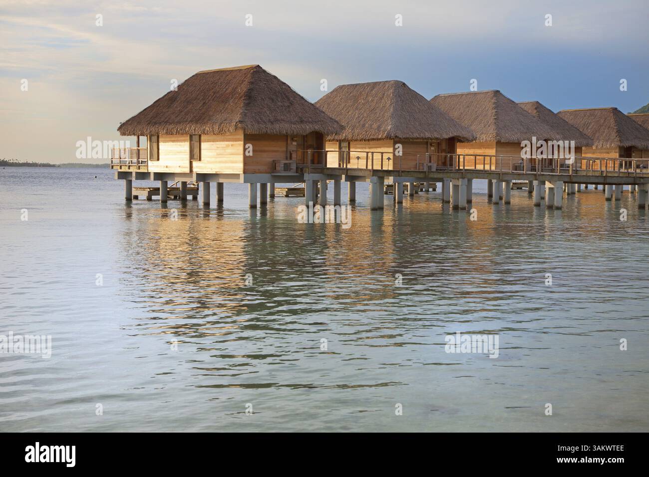 Simple wooden huts on poles in the water Stock Photo - Alamy
