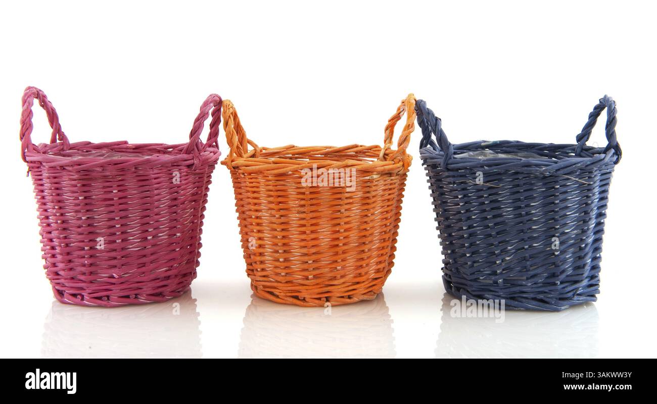 Colorful empty baskets in a row on white background Stock Photo - Alamy
