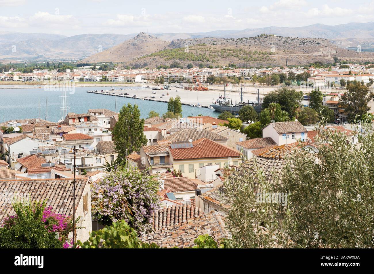 The city Nafplion with houses and roofs near the harbor in the Argolic ...
