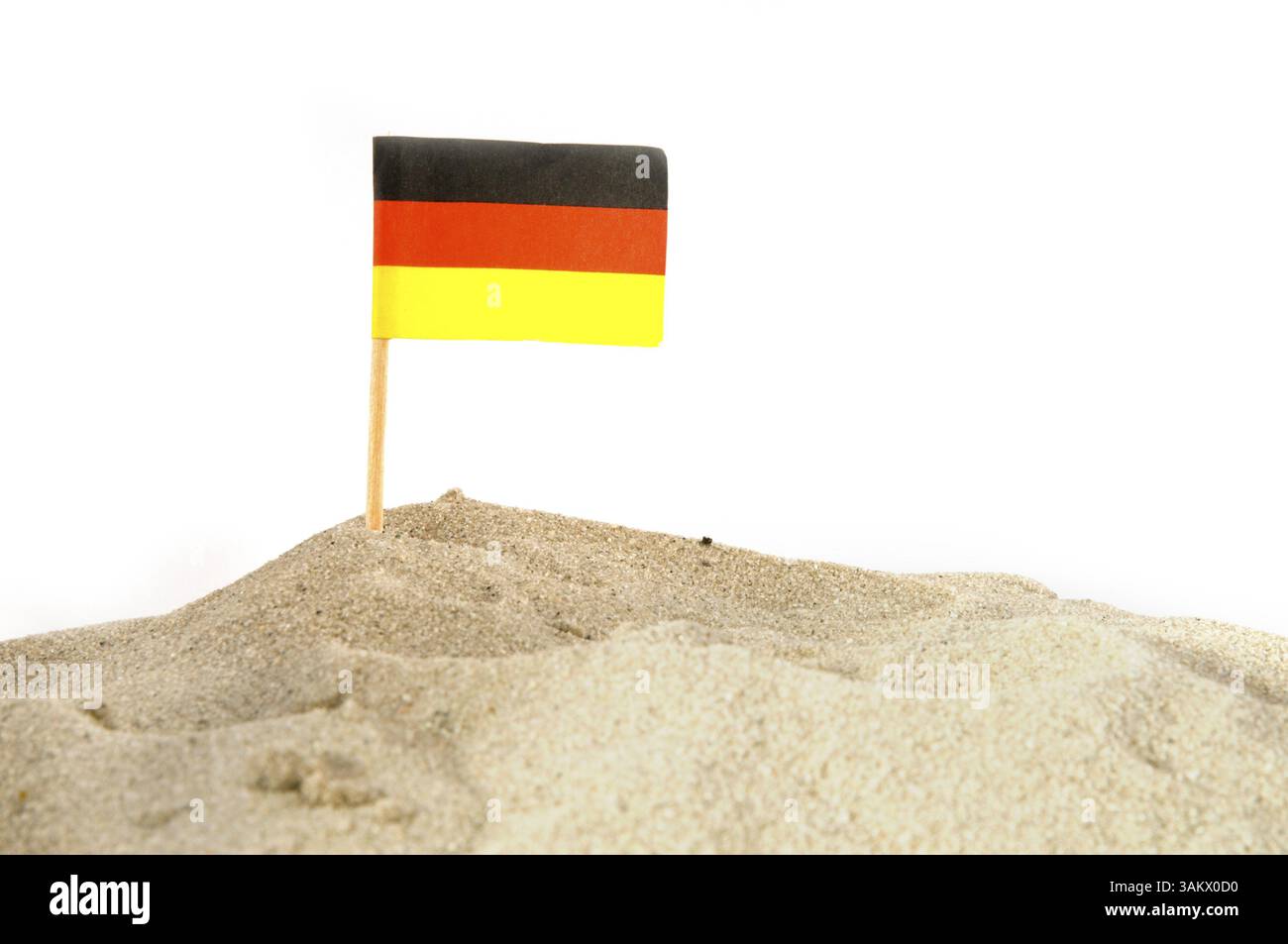German beach with sand dunes and flag Stock Photo - Alamy