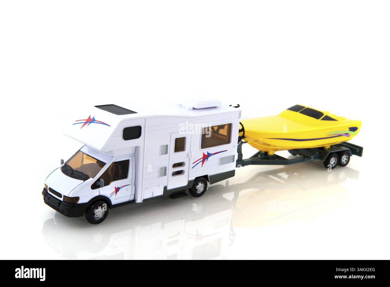 Mobil home with boat on the trailer Stock Photo - Alamy