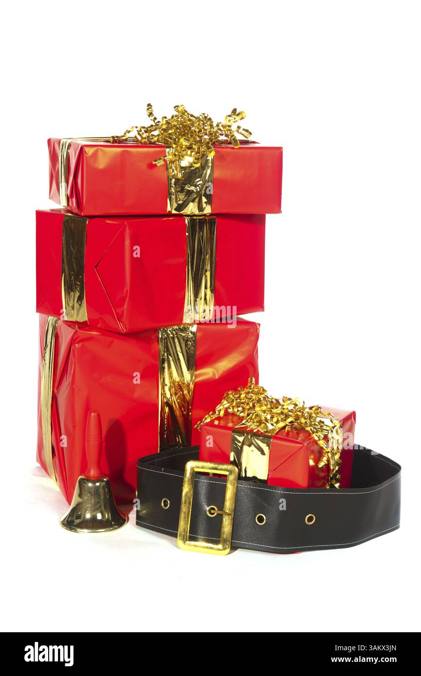 Christmas presents in red and gold with cloths from Santa Claus Stock ...