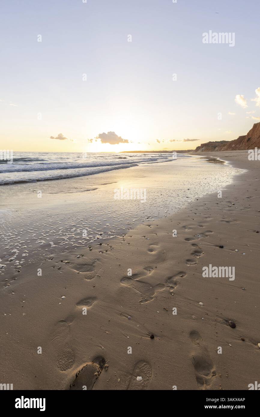 The golden sandy beach of Praia da Falesia, crystal clear sea water at ...