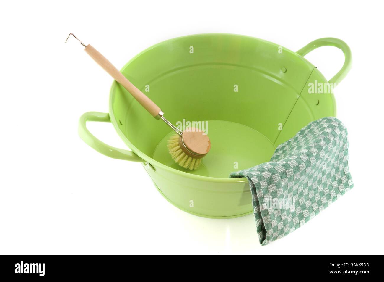 Washing the dishes in the green barrel Stock Photo - Alamy