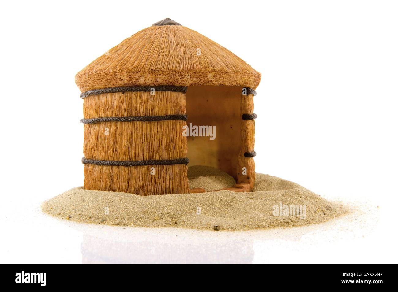 African straw hut in the sand isolated over white Stock Photo - Alamy