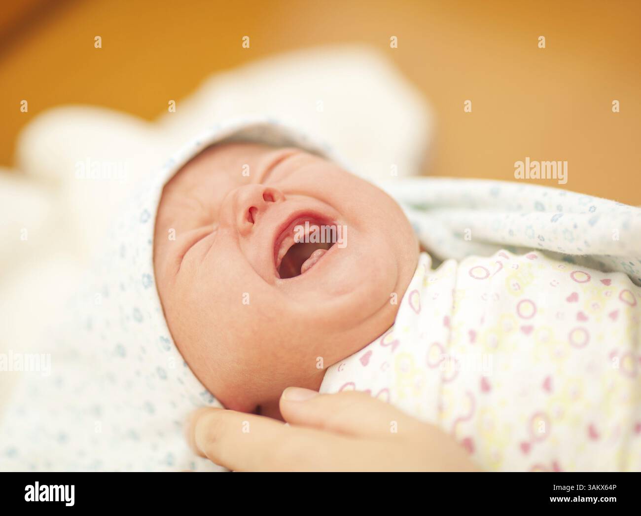 Baby crying home hi-res stock photography and images - Alamy