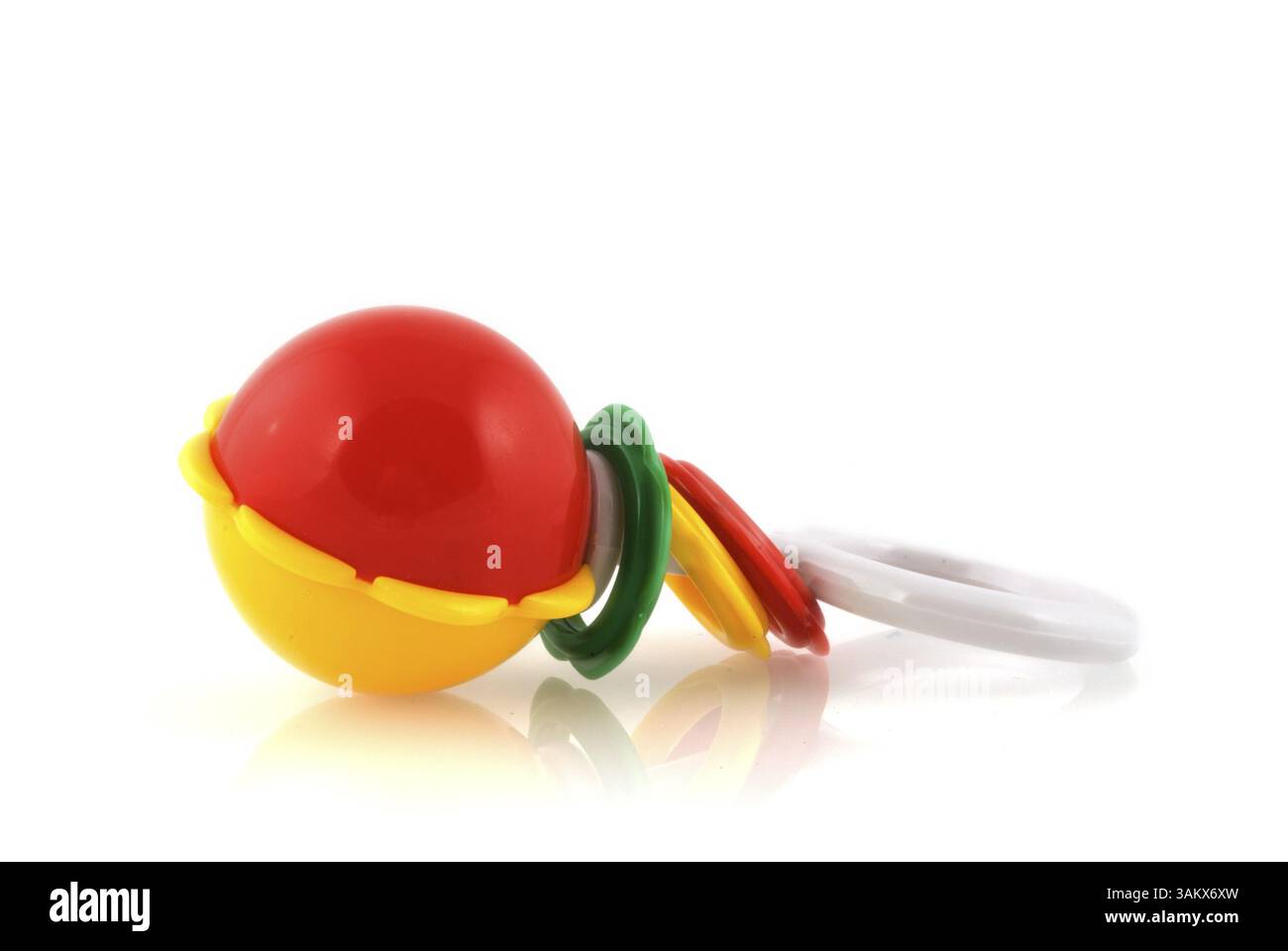 Baby rattle in red and yellow Stock Photo - Alamy