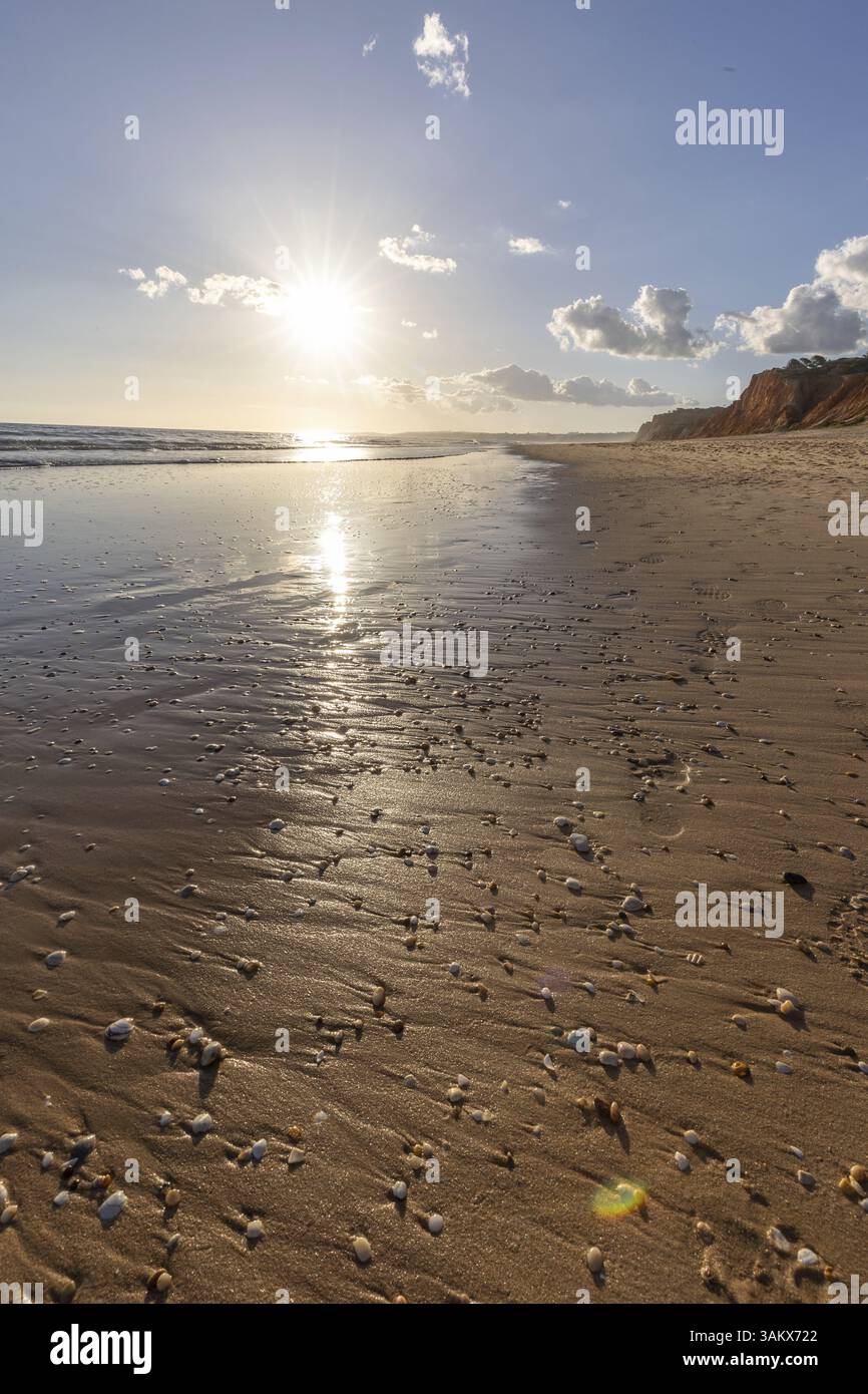 The golden sandy beach of Praia da Falesia, crystal clear sea water at ...