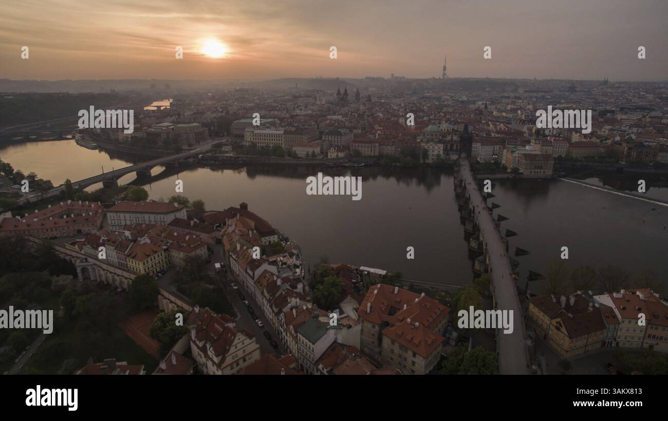 Aerial - Prague city view with bridges over Vltava river at golden sun ...