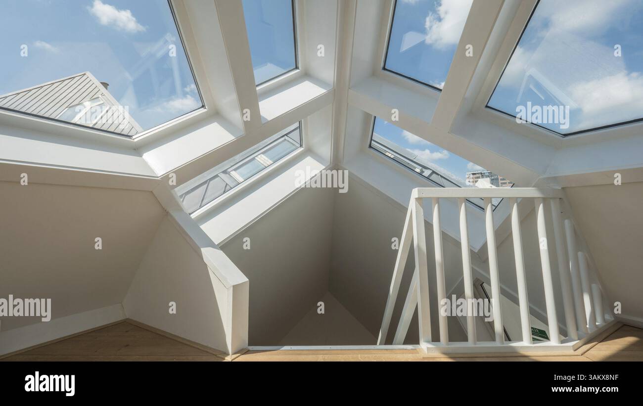 Inside the Cube House. View to the stairs leading down and blue sky ...