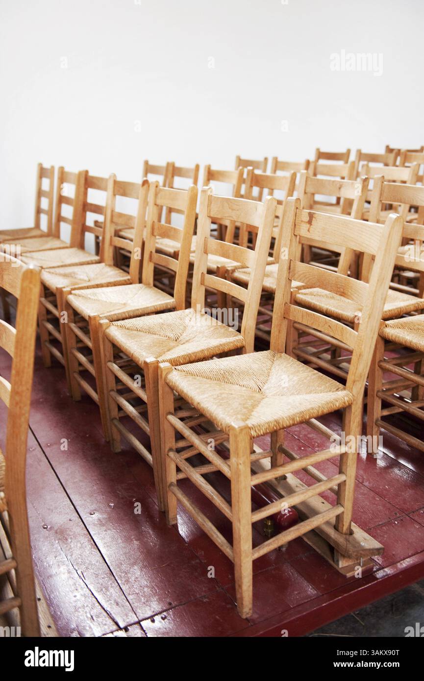 Rows with wooden chairs in the church Stock Photo - Alamy