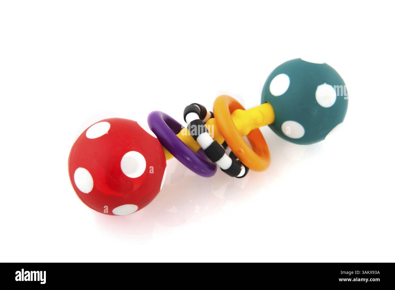 Colorful speckles baby rattle Stock Photo - Alamy