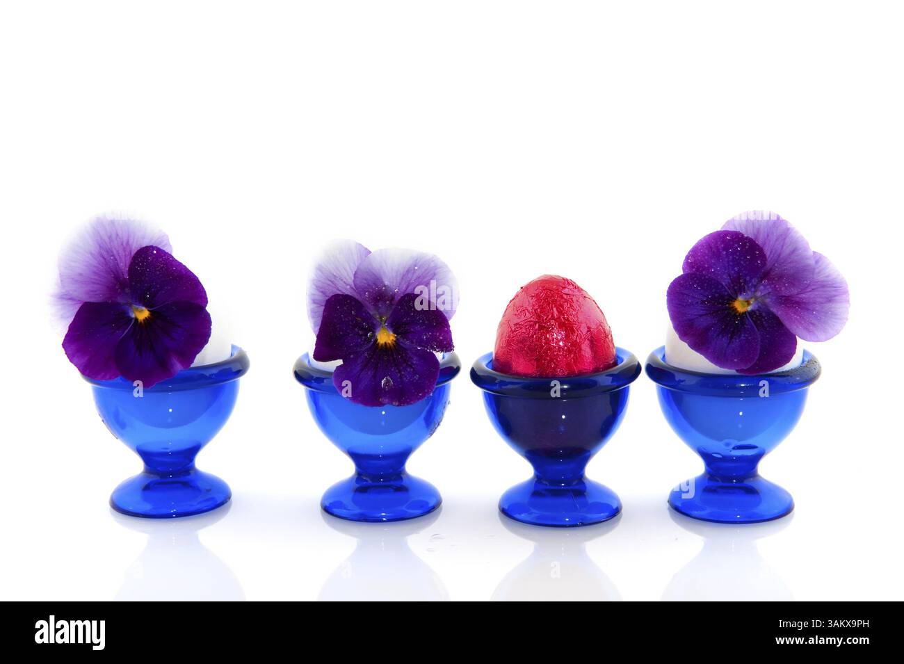 Easter with violin flowers and chocolate egg Stock Photo - Alamy