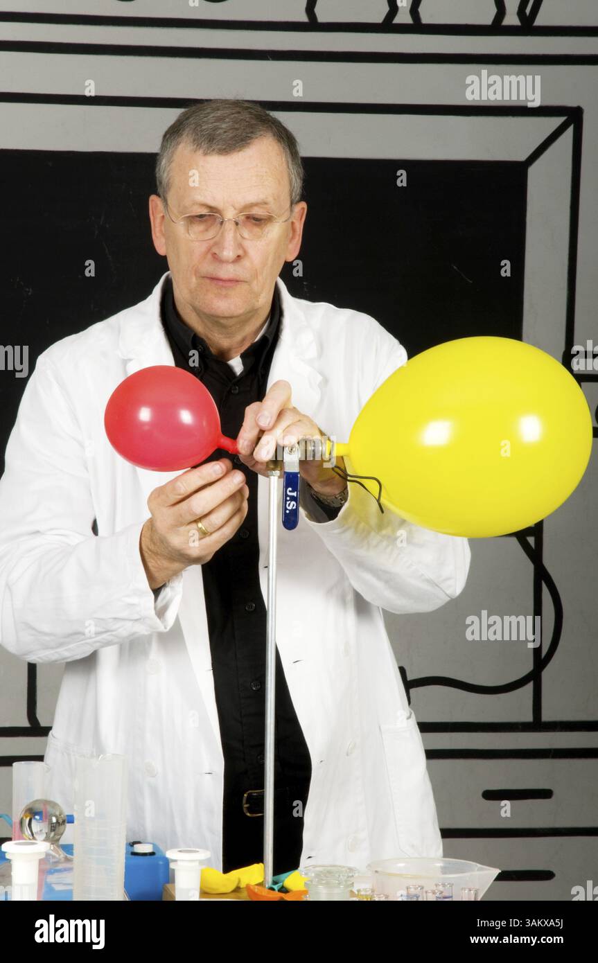 Serious professor with balloon experiment in the laboratory Stock Photo ...