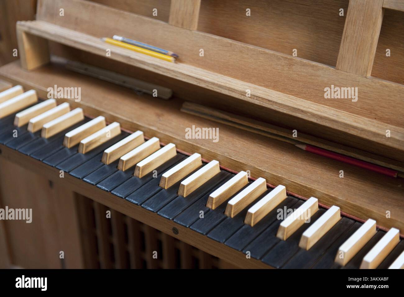 Wooden church organ with black dark keyboard Stock Photo - Alamy